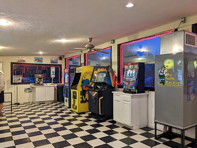 The arcade area offers entertainment before the main feature begins. Those vintage games and checkerboard floors transport you straight to simpler times.
