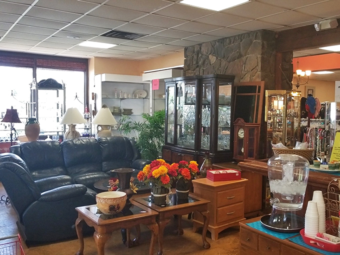 Living room vignettes staged with the care of a Broadway set designer. That stone wall backdrop deserves its own HGTV special.