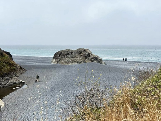 Massive rock formations stand like sentinels guarding the beach's secrets. Nature's sculpture garden that puts modern art to shame.