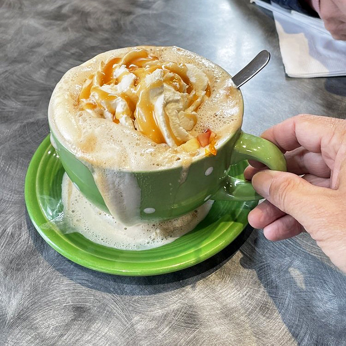 Coffee art that's almost too pretty to drink. Almost. The caramel drizzle is nature's way of saying "good morning" with enthusiasm.