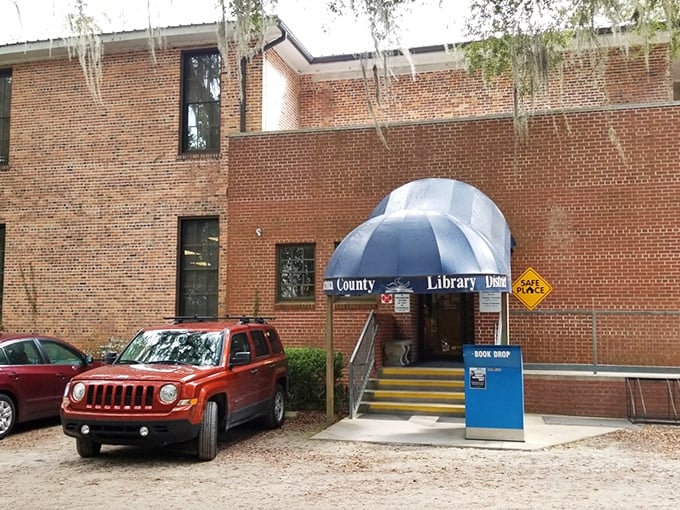 Even the county library embraces Micanopy's laid-back charm, with its blue umbrella entrance and casual parking arrangement.