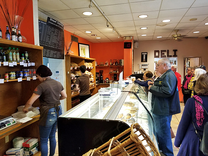 The universal language of anticipation—customers lined up for their fix of authentic German baked goods. Some addictions are worth embracing.