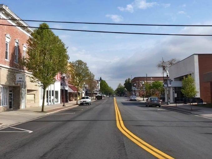 Main Street stretches toward the horizon, its yellow centerline a reminder that in Ada, you're never far from somewhere worth going.