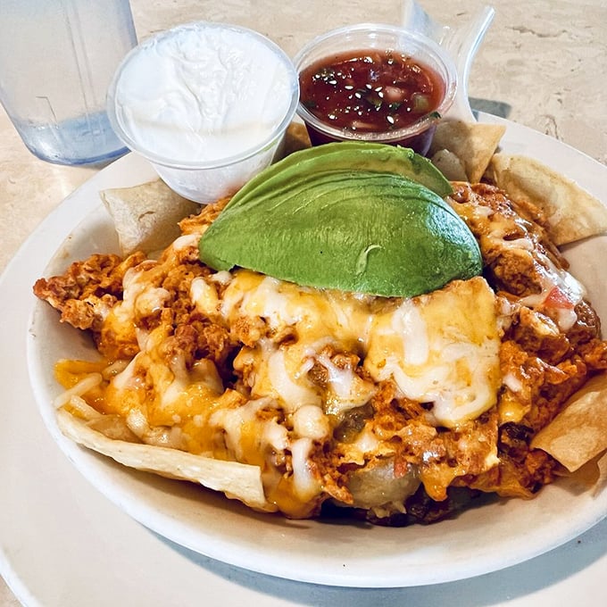 When Mexican flavors crash the breakfast party, everyone wins. That avocado crown and melted cheese blanket turn simple ingredients into morning royalty.