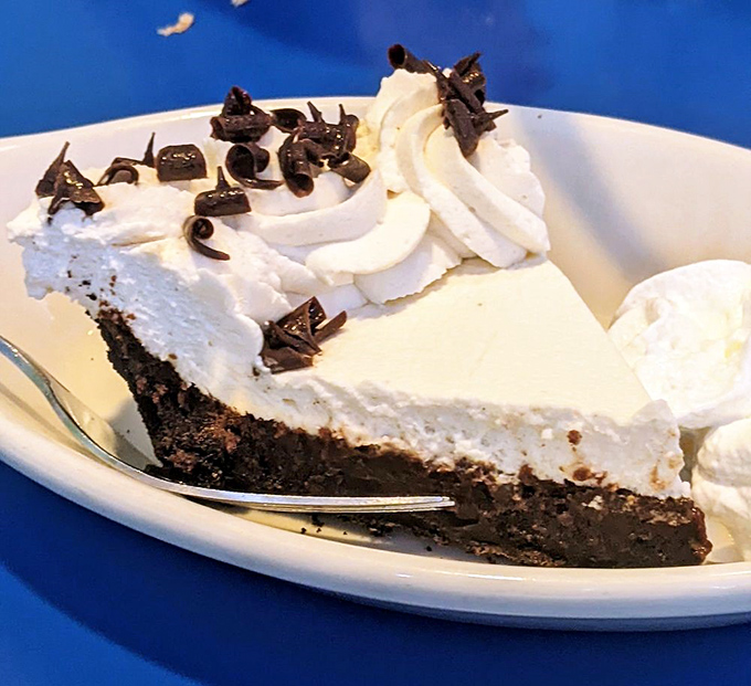 This isn't just pie &ndash; it's a chocolate-whipped cream skyscraper of joy that makes calorie-counting seem like the silliest concept ever invented.
