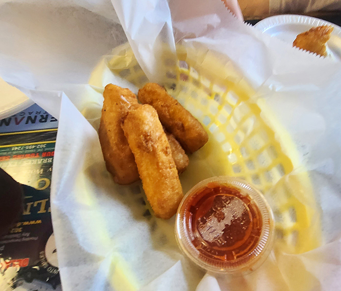 Mozzarella sticks: where the cheese pull is the ultimate measure of success. These golden beauties are ready for their stretchy, gooey close-up.