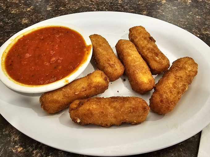 Golden-brown mozzarella sticks with marinara – the universal language of "Yes, you deserve this" spoken in crispy, cheese-pulling perfection.