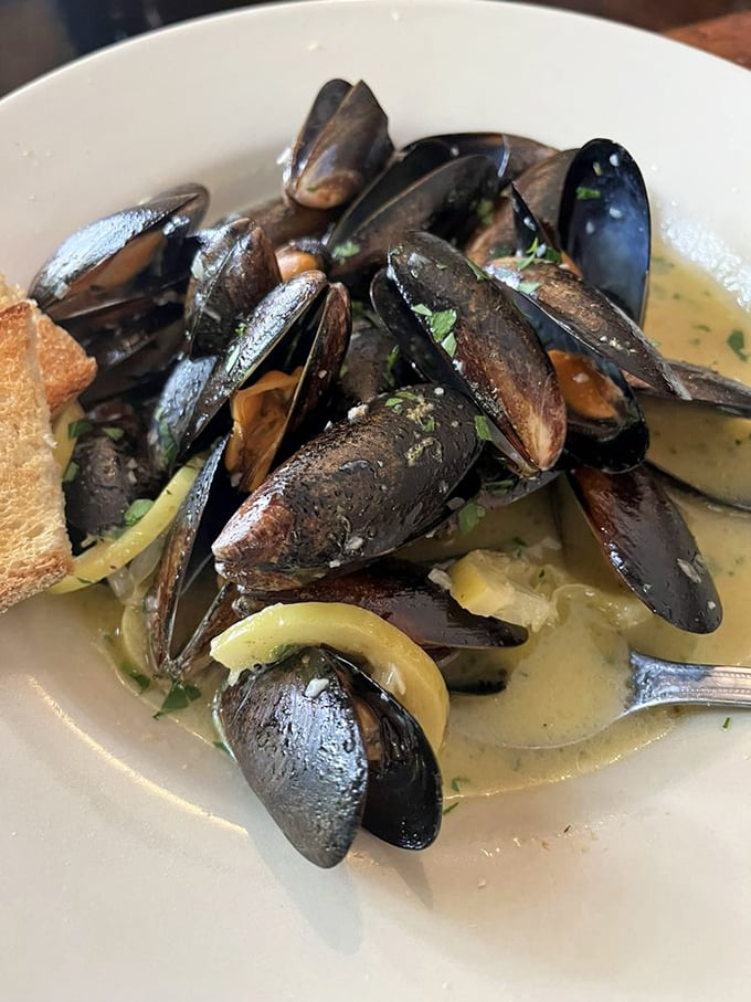 Mussels bathing in white wine broth that you'll be sopping up with bread long after the shells are empty.