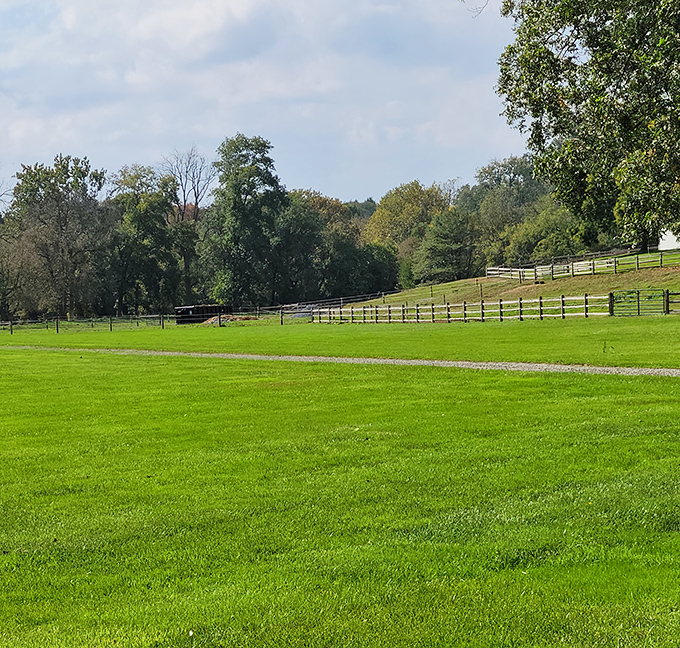 Beyond the bridge, Lancaster's famous farmlands roll into the distance, showcasing the agricultural heritage that defines the region.