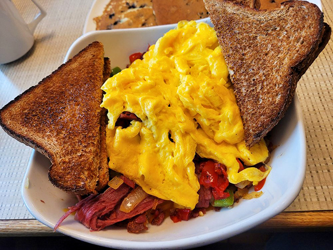 Scrambled eggs nested among colorful veggies and toast—like breakfast decided to dress up for a special occasion.