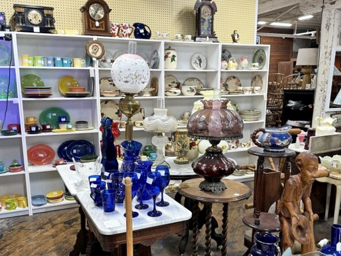 Grandma's china cabinet exploded in the best possible way. Blue glassware catches the light while vintage timepieces remind us that collecting is timeless.