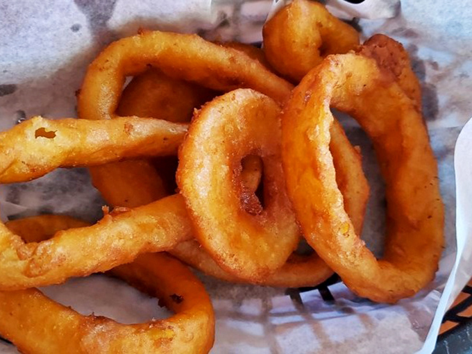These onion rings aren't just side dishes&mdash;they're golden halos of happiness that make you question why anyone would ever choose fries instead.