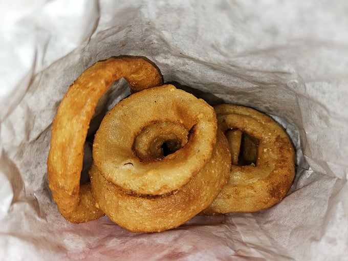 These aren't just onion rings&mdash;they're golden halos of happiness that crunch loud enough to drown out your diet's complaints.