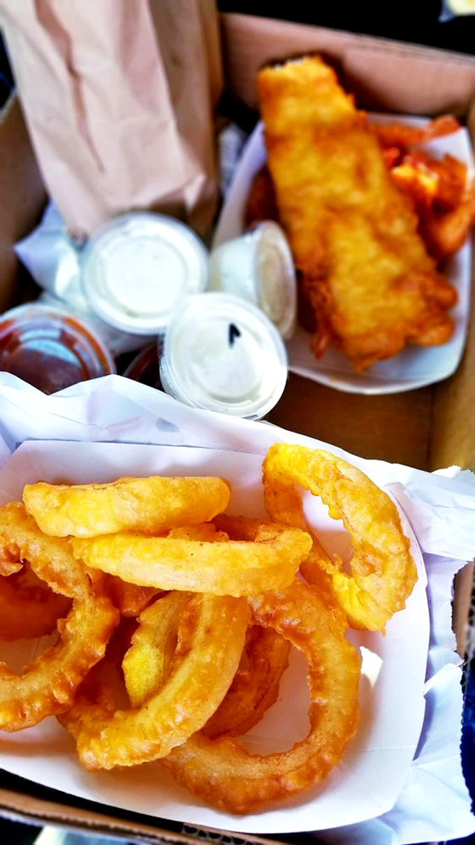 Onion rings and fish, a pairing as perfect as Bogart and Bacall. That golden batter holds secrets that chain restaurants would kill to know.
