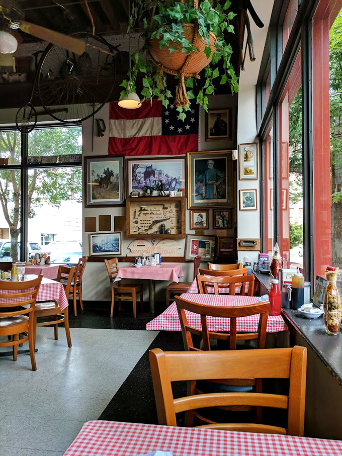 American flags and vintage photographs line the walls, creating a museum-like atmosphere where the exhibits are edible and the history lesson comes with gravy.