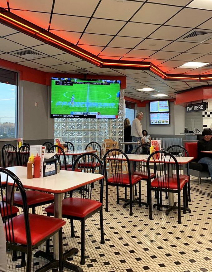 Red neon lighting and checkered floors create that classic American diner atmosphere where every meal feels like a celebration.