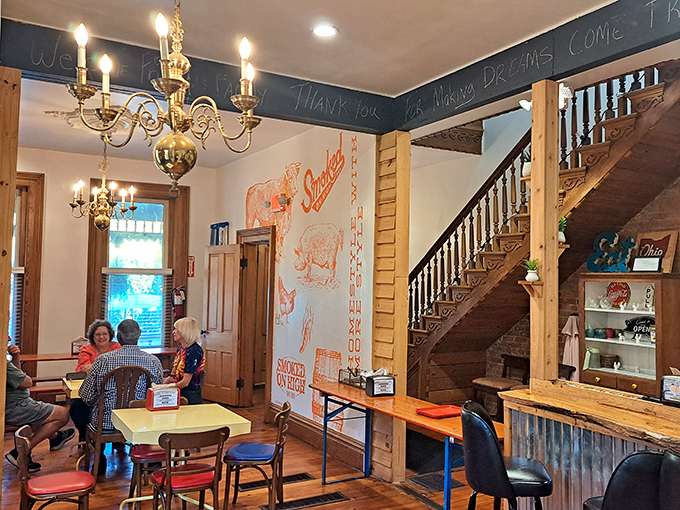 That chandelier hanging above barbecue tables? It's like Downton Abbey and Texas had a delicious baby. Note the pig artwork&mdash;a fitting tribute.
