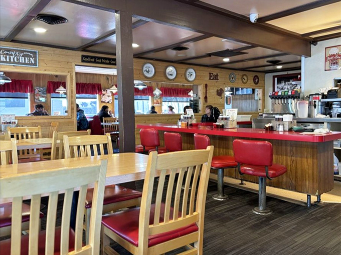Classic diner aesthetics meet BBQ joint coziness with those signature red counter stools just waiting for your story.