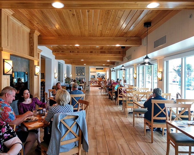 Warm wood tones and natural light create an atmosphere where conversations flow as easily as the coffee&mdash;comfort food deserves comfortable surroundings.