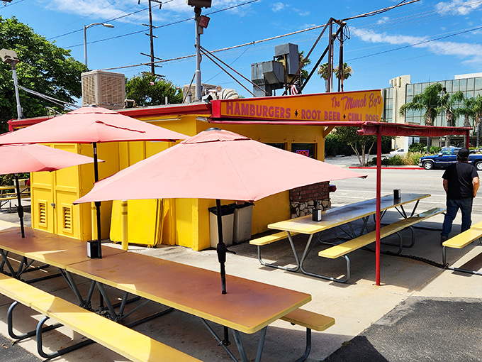 The yellow picnic tables under coral umbrellas aren't just seating&mdash;they're front-row tickets to the best show in town: lunch.