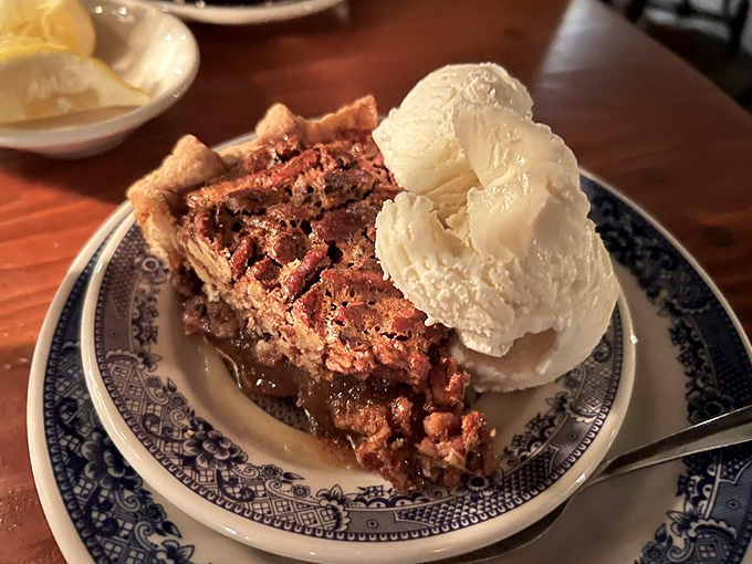Pecan pie that would make Jefferson weep with joy &ndash; rich, gooey, and topped with ice cream melting into warm filling like the perfect culinary surrender.