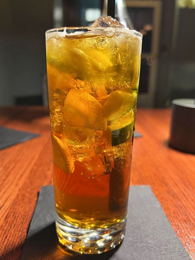 A Pimm's Cup that's basically summer in a glass. Those fresh fruits aren't just garnish &ndash; they're little flavor ambassadors doing important work.