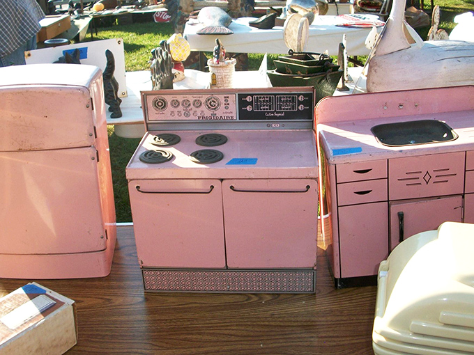 Pastel pink kitchen appliances that scream mid-century charm. This miniature culinary time capsule would make Betty Draper swoon and modern collectors reach for their wallets.