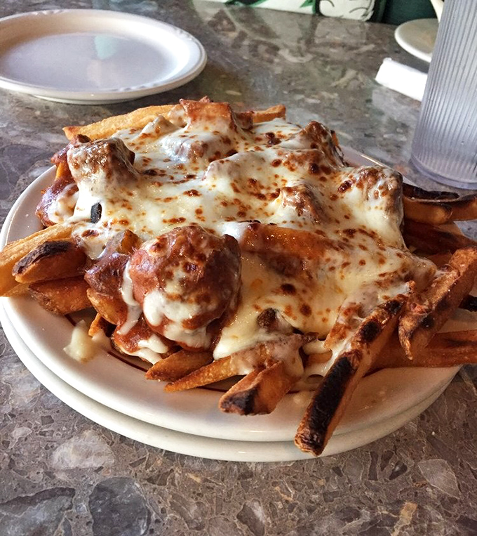 French-Canadian poutine meets Polish hospitality&mdash;crispy fries buried under an avalanche of melted cheese and magic. Diet plans surrender at the table.