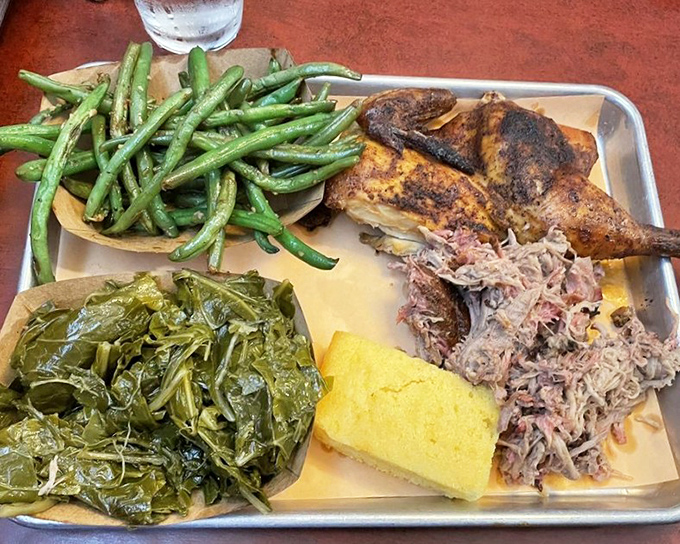 A symphony of Southern sides – vibrant green beans and collards flanking pulled pork and chicken that spent quality time in the smoker.