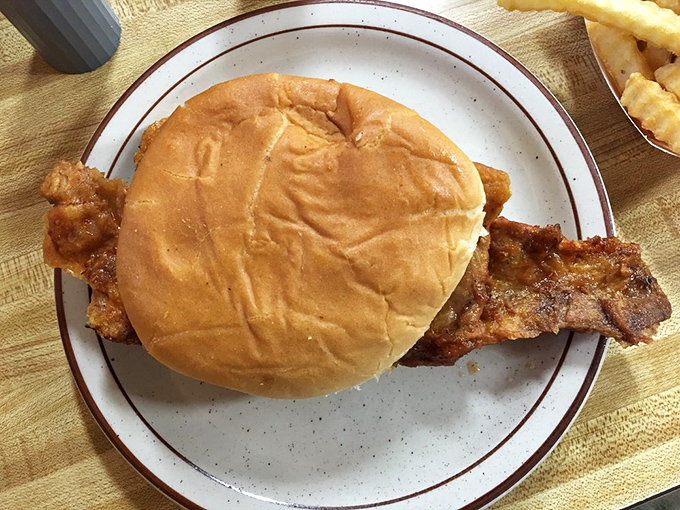 This sandwich doesn't need fancy toppings to impress – just honest pork that's had a long, meaningful conversation with smoke and time.