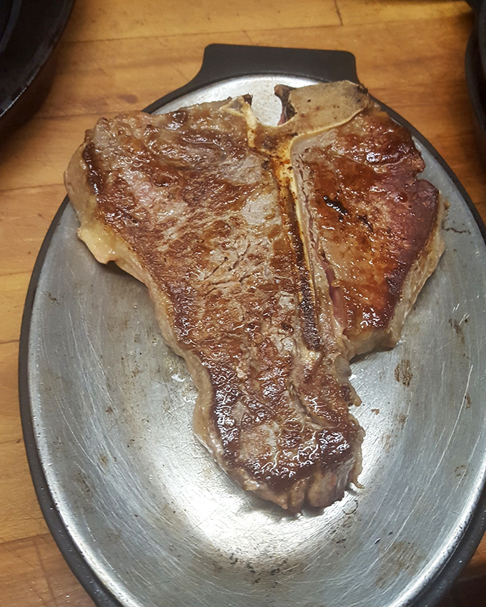 The T-bone: nature's way of saying "why choose between strip and tenderloin when you can have both?"