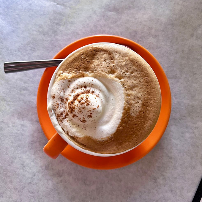 Their signature pumpkin steamer arrives in a cheerful orange cup, topped with cinnamon-dusted foam&mdash;autumn in liquid form.