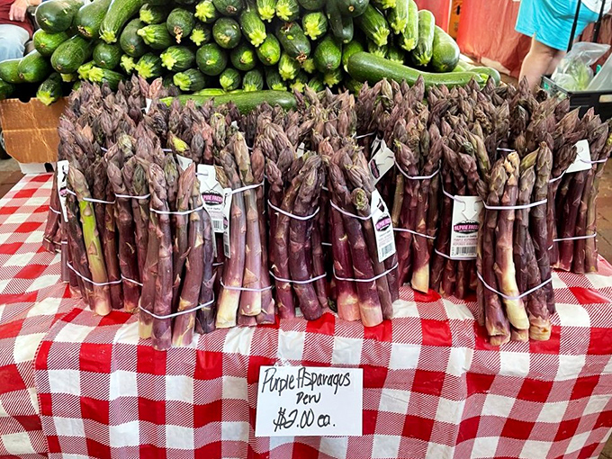 Purple asparagus bundles stand at attention like edible bouquets, proving vegetables can be both delicious and Instagram-worthy.