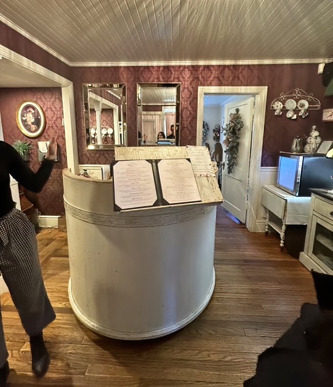 The hostess stand: gateway to gentility. Where reservations are confirmed and the promise of scones becomes tantalizingly real.