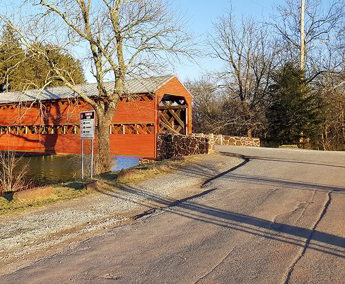 Morning light casts long shadows across the approach to the bridge, inviting early visitors to step back in time.