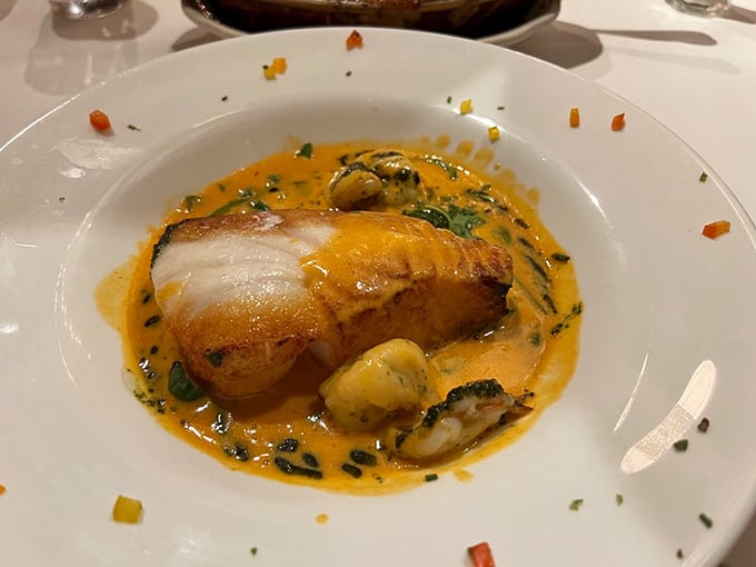 This sea bass swimming in saffron sauce isn't just dinner; it's an underwater ballet that ends with a standing ovation from your taste buds.