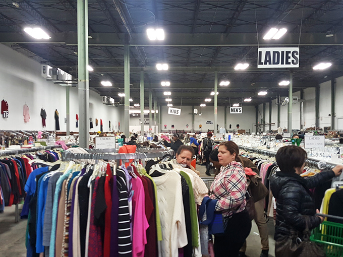Serious shoppers in their natural habitat, methodically combing through racks with the focus of archaeologists at a promising dig site.