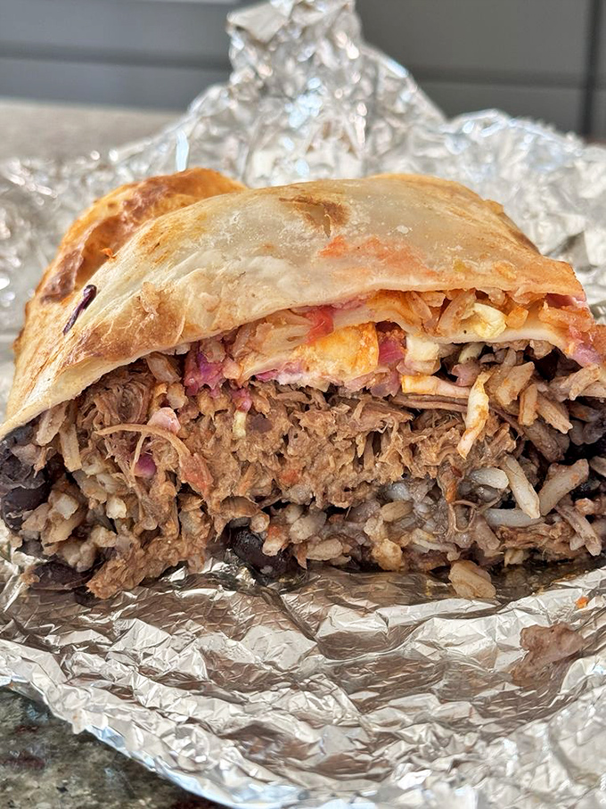 Behold the burrito in its natural habitat&mdash;aluminum foil. Cut open to reveal layers of flavor that tell a delicious California story.