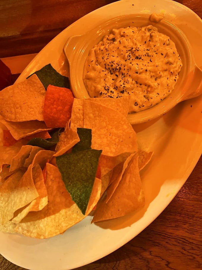 Dip so good you'll consider drinking it when no one's looking. Those multicolored chips are just vehicles for the creamy seafood treasure underneath.