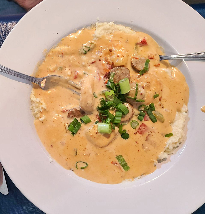 Shrimp and grits that could make a Southerner homesick, with green onions adding that perfect pop of color and freshness.