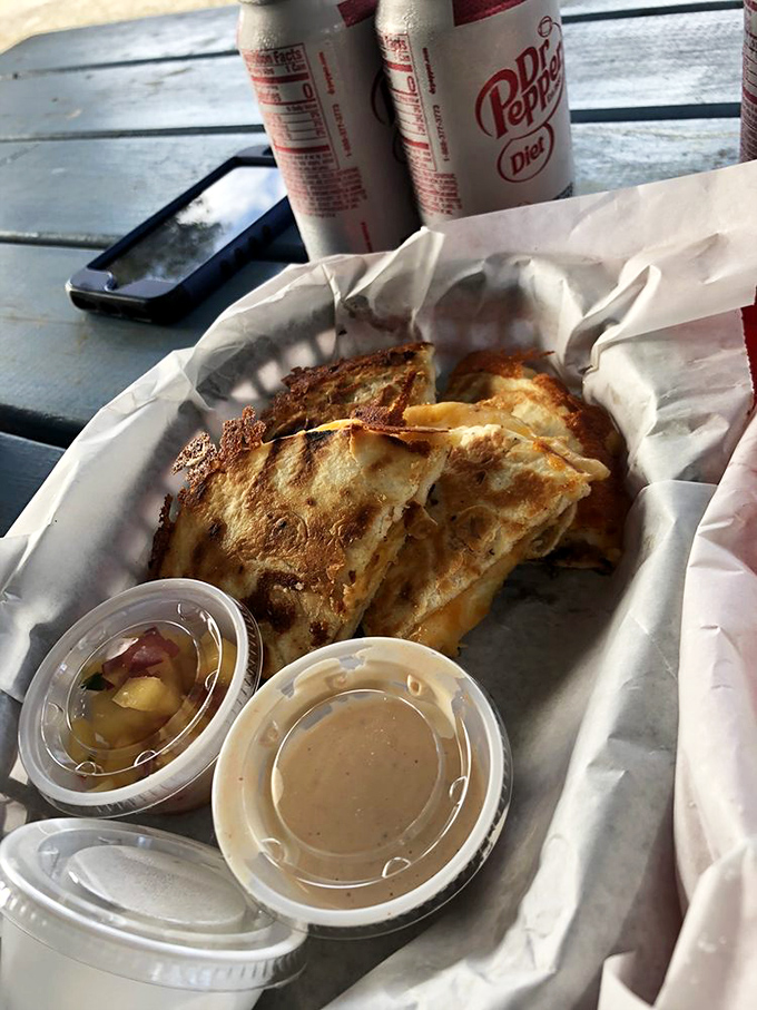 This quesadilla has achieved what diplomats cannot&mdash;perfect harmony between sea and land. The lime isn't decoration; it's essential punctuation to this cheesy narrative.