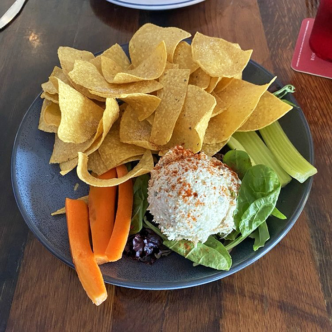 The smoked fish dip&mdash;Florida's unofficial appetizer&mdash;sits proudly surrounded by colorful veggies and crisp tortilla chips, ready for its moment.