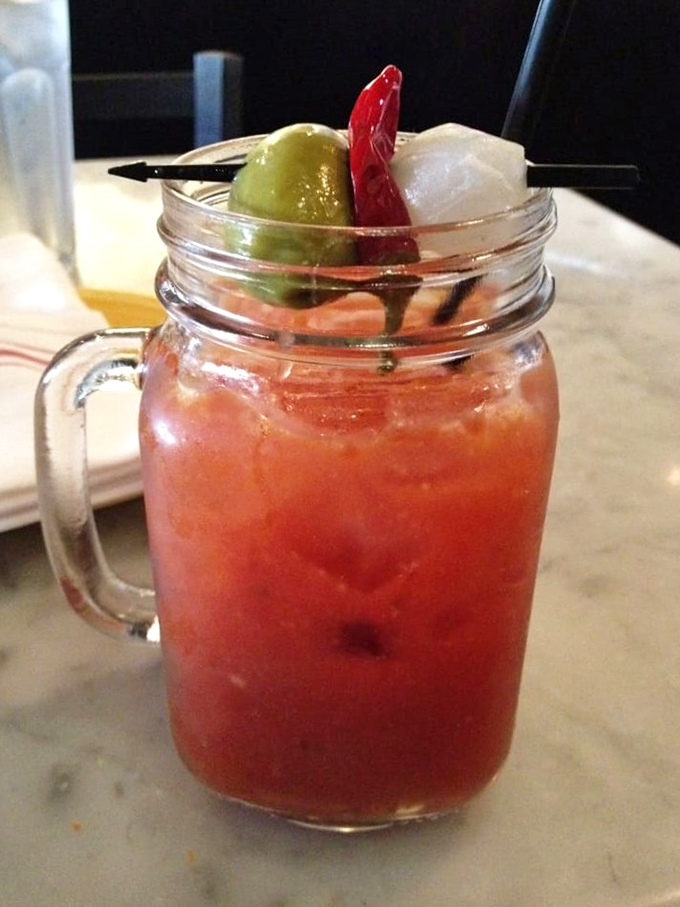 This isn't your average Bloody Mary—it's a spicy, garden-in-a-jar masterpiece that makes waiting for your pizza feel like a happy hour celebration.