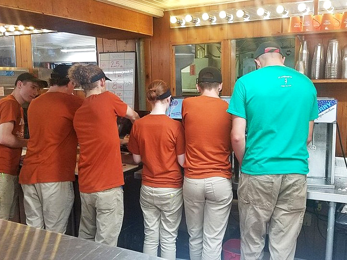 The assembly line of ice cream artisans, working with the precision and focus of NASA engineers during a moon landing.