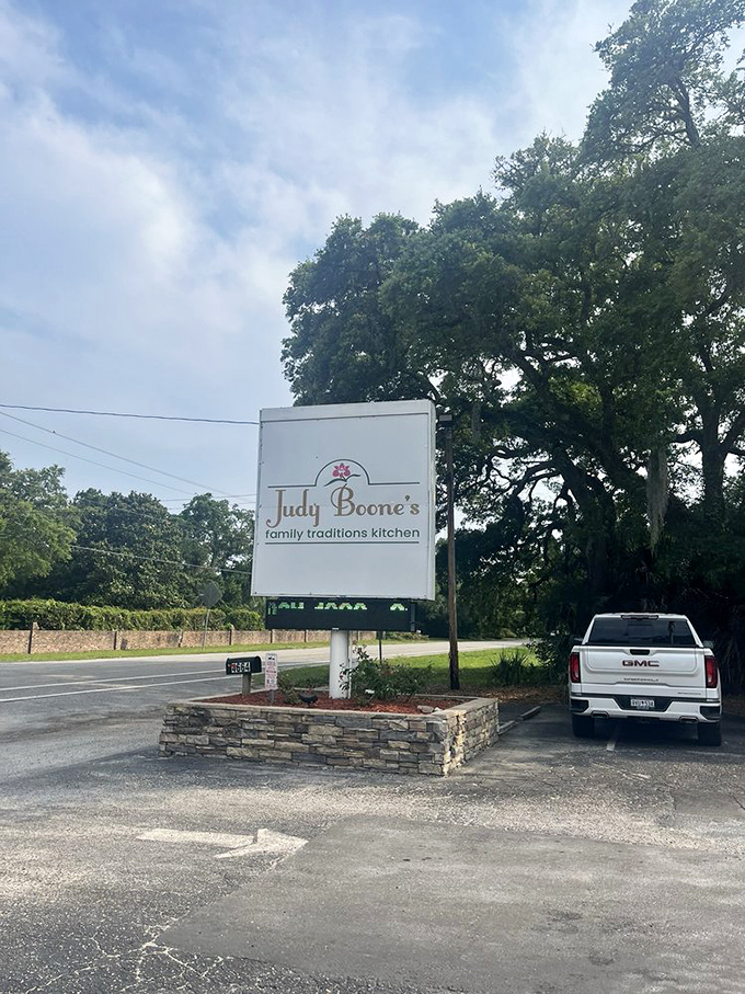 The roadside sign stands like a beacon of hope for hungry travelers. Follow it to flavor town, population: you.