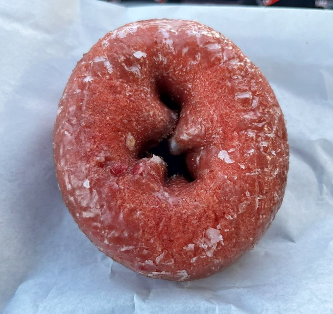 This strawberry cake donut isn't playing games – it's serious about its mission to deliver pure, unadulterated joy in circular form.