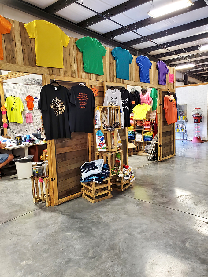 The rainbow of t-shirts tells the story of local pride, inside jokes, and vacation memories all hanging in perfect chromatic order.