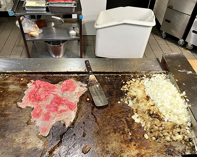 Behind the scenes magic &ndash; where thinly sliced ribeye meets the sizzling grill. The start of something beautiful.