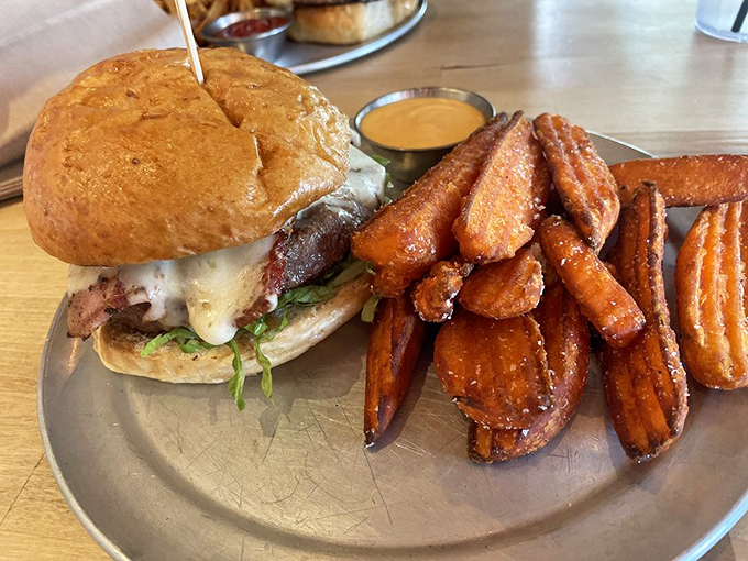 A burger that understands the transformative power of melted cheese and a perfectly toasted bun. The fries are just showing off at this point.