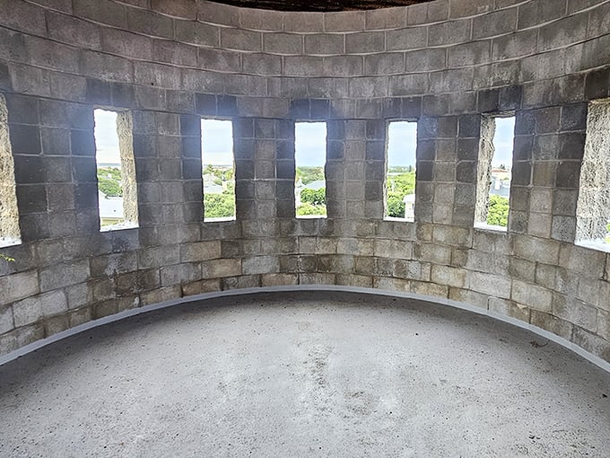 The curved tower interior offers narrow windows that frame perfect slices of Florida sky, creating natural artwork on the stone walls.